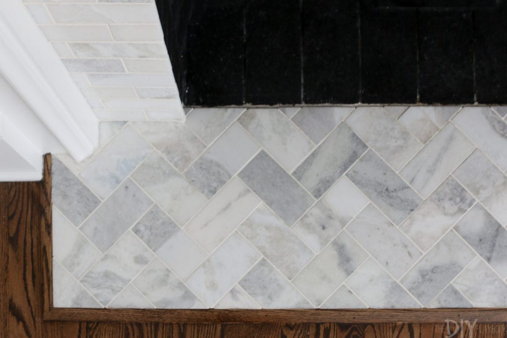 A White Marble Tile Fireplace Update | The DIY Playbook