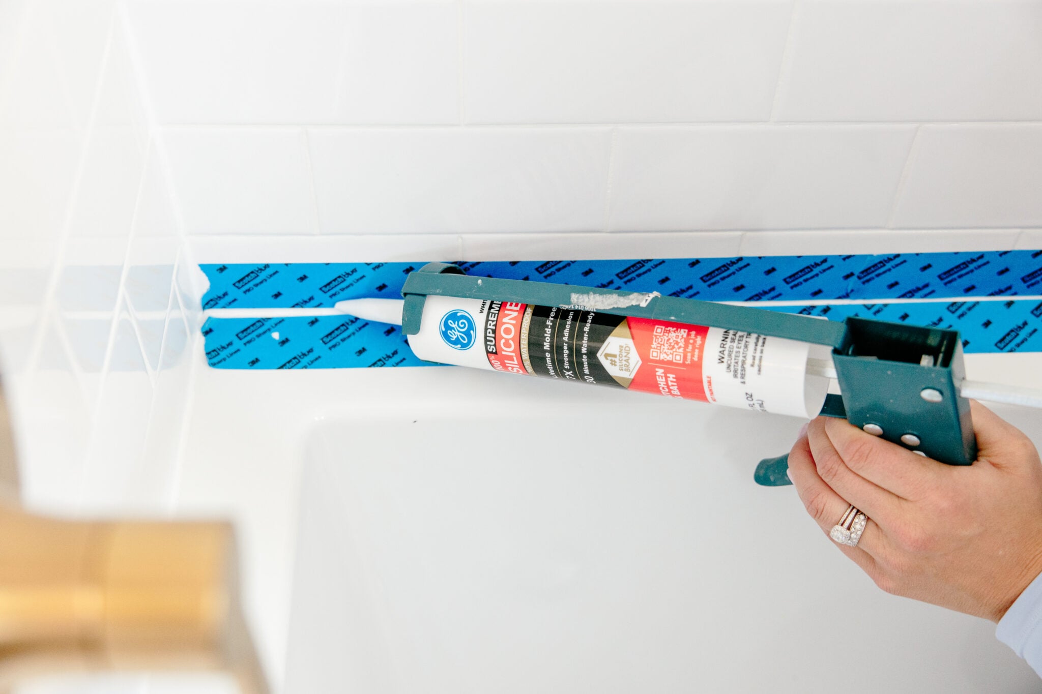 How to Recaulk a Bathtub, Step-by-Step | The DIY Playbook